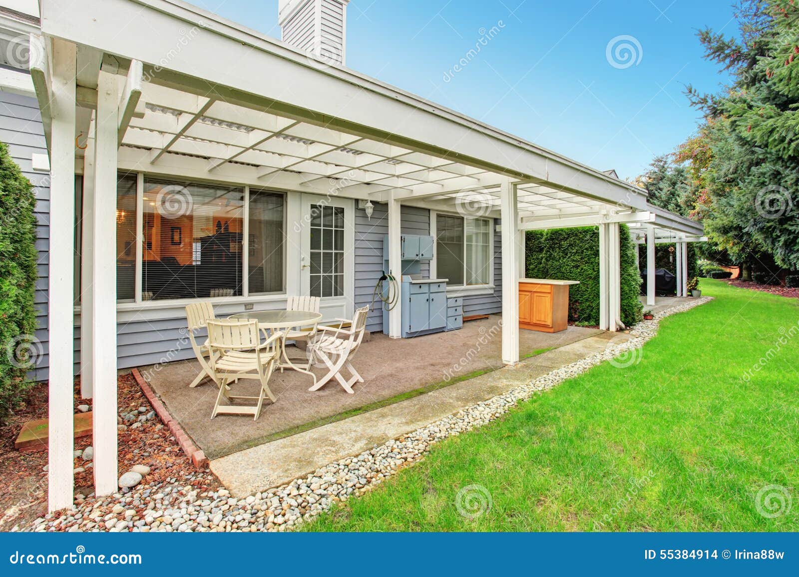 Covered Back Deck With Concrete Floor And Outdoor Furniture. Stock ...