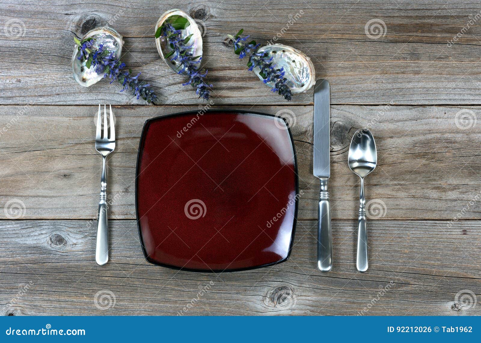 Simple Dinner and Silverware Setting Along with Nature Decorations on ...