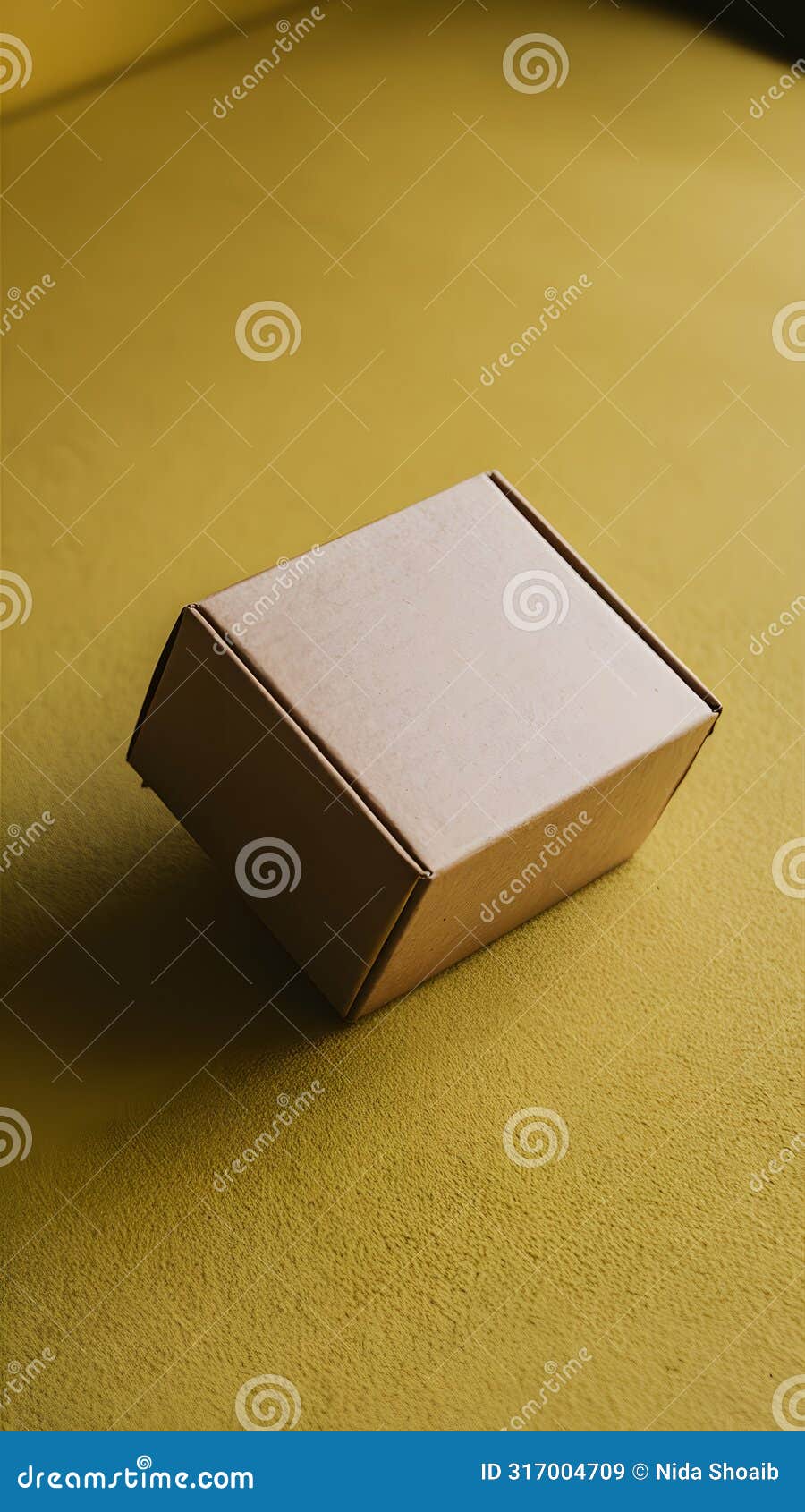 Simple, Functional Tilted Cardboard Box on a Yellow Surface, Closed Lid ...