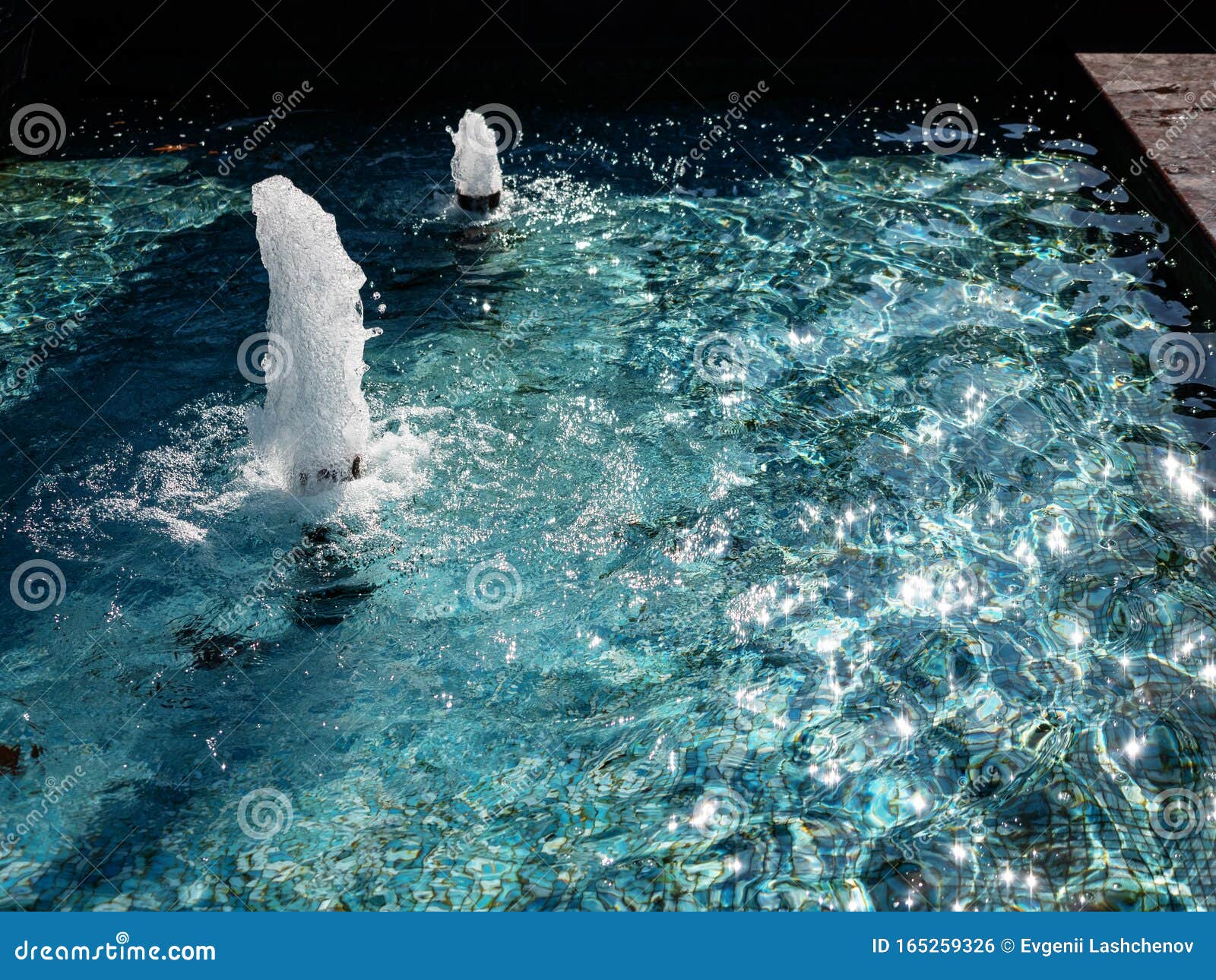 Simple Little Fountain with Blur Background in the Evening Stock Photo ...