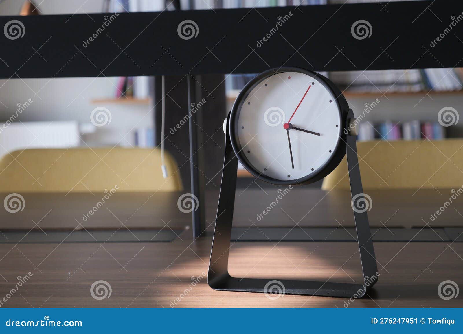 Simple Modern Clock on a Book Shelf . Stock Image - Image of silver ...