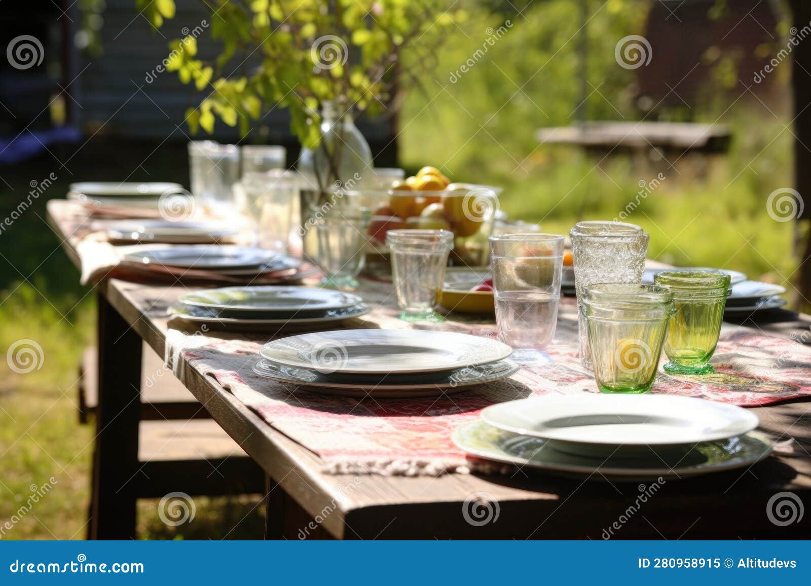 A Simple Picnic Table Setting with Plates, Silverware and Glasses Stock ...