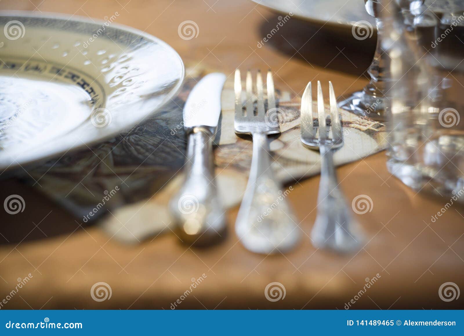 A Simple Picture of a Table Setting with Dishes and Cutlery and Glass ...