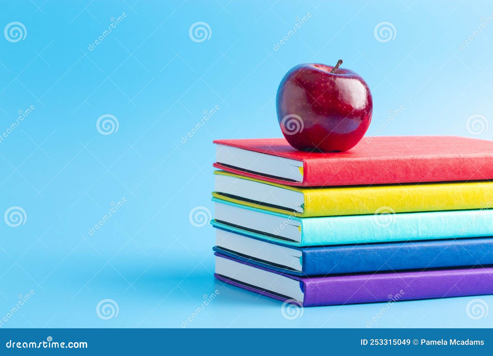 Simple Stack of Rainbow Books and an Apple a Background for Back To ...