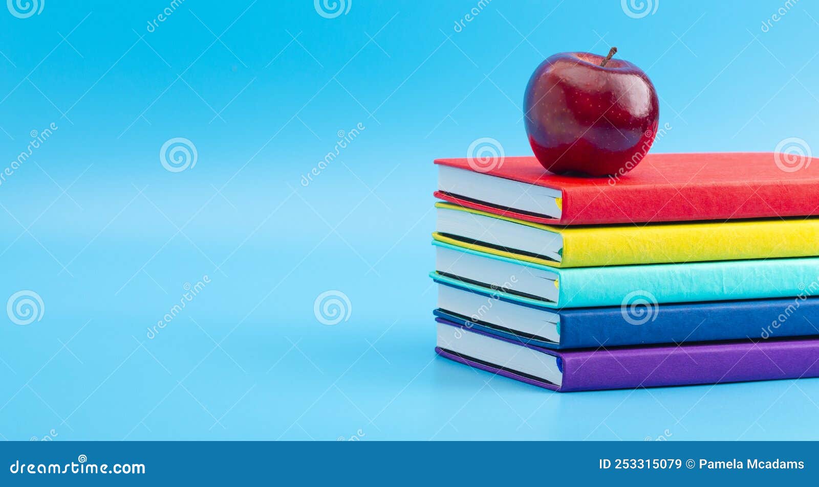 Simple Stack of Rainbow Books and an Apple a Background for Back To ...