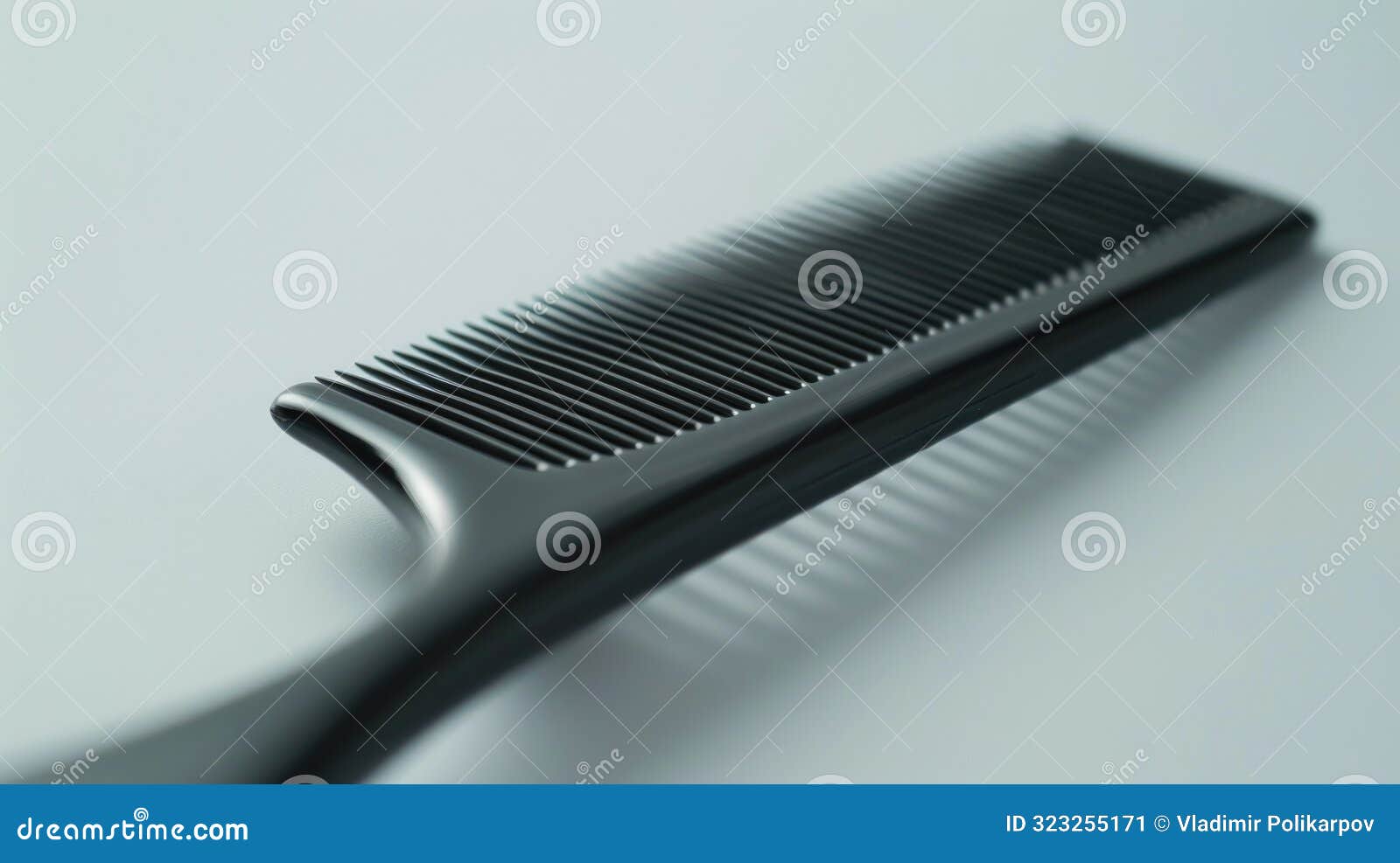 A Simple Still Life Image of a Black Comb Resting on a White Table ...
