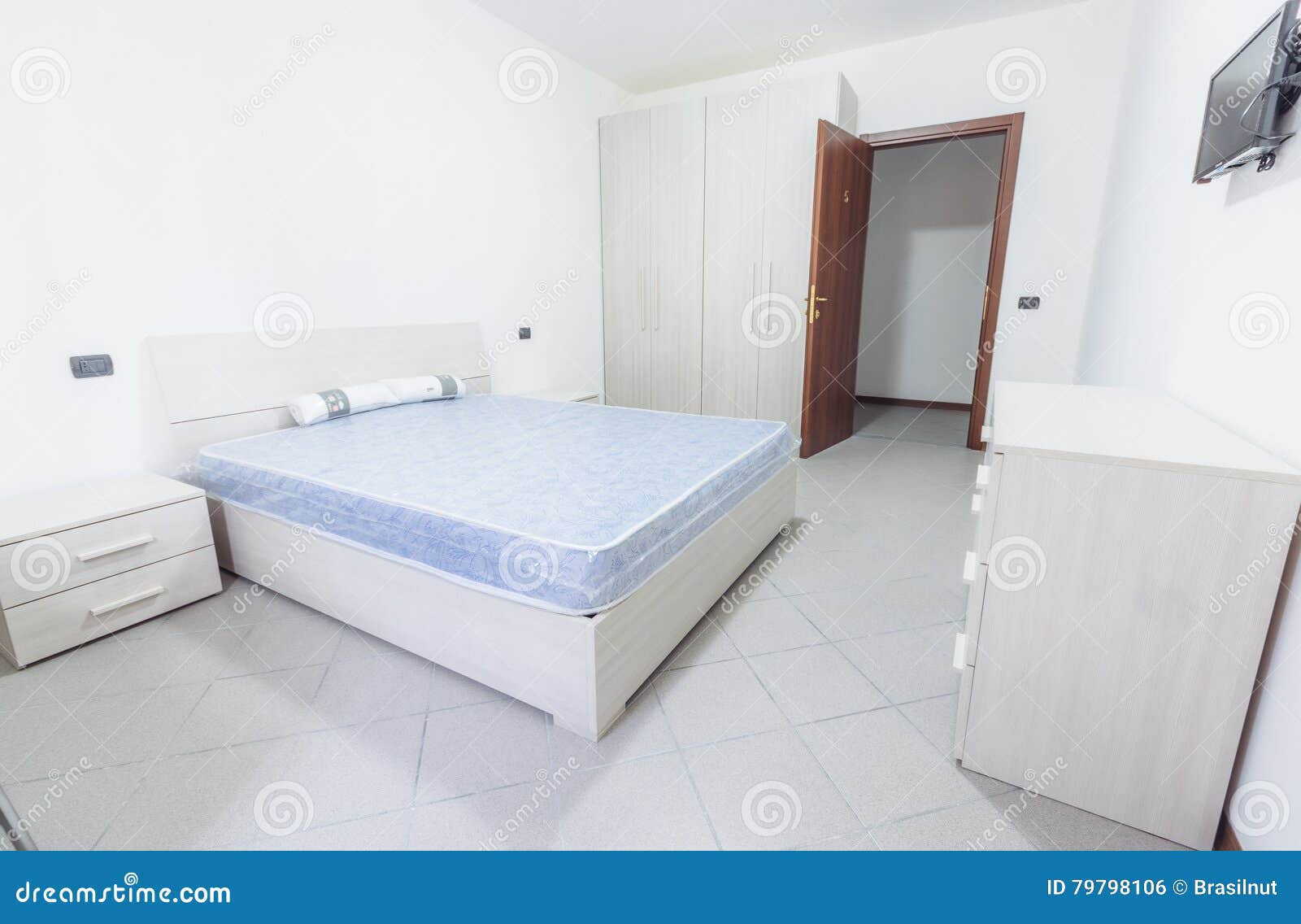 Simple Student-style Dorm Bedroom with Lots of Light Stock Photo ...