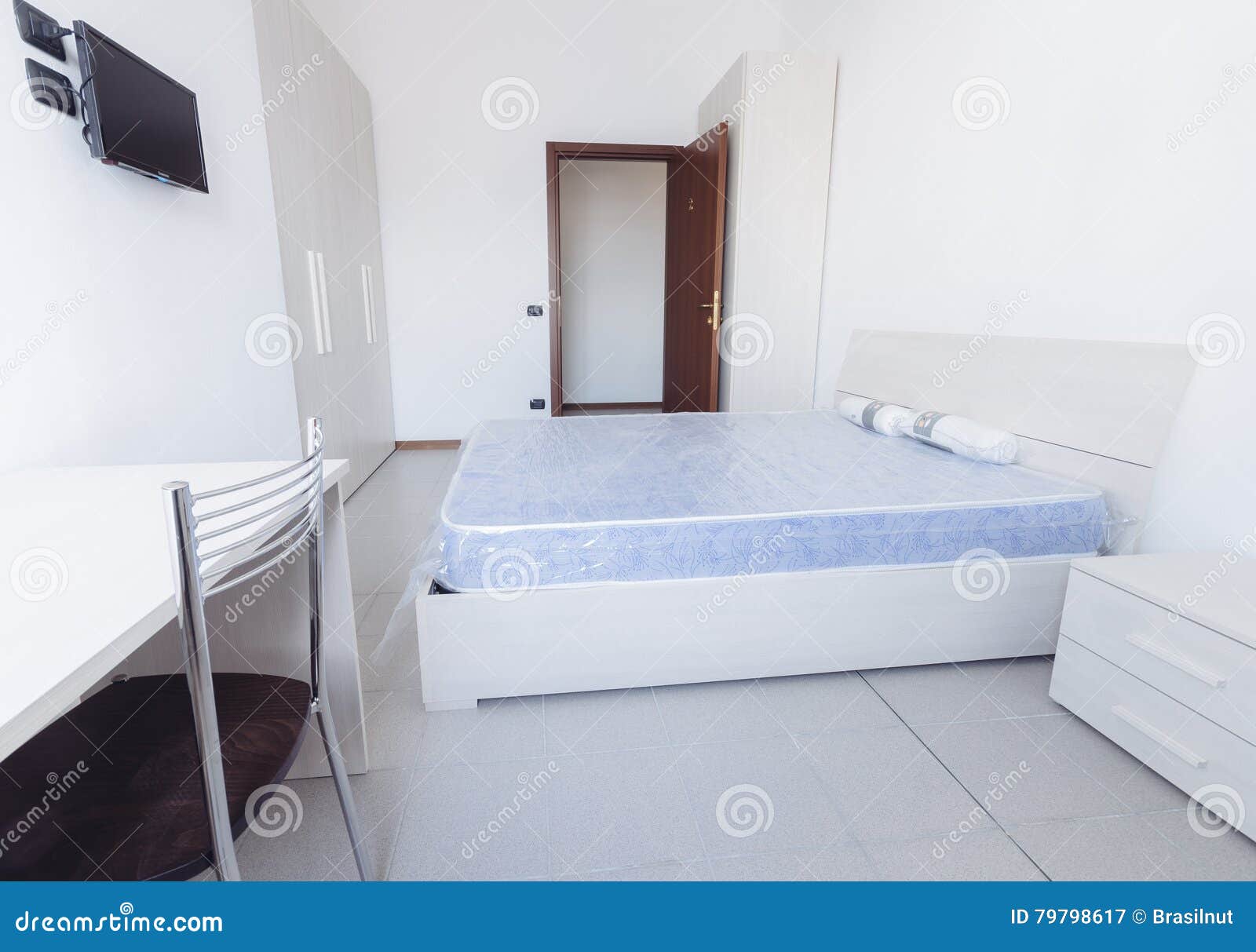 Simple Student-style Dorm Bedroom with Lots of Light Stock Image ...