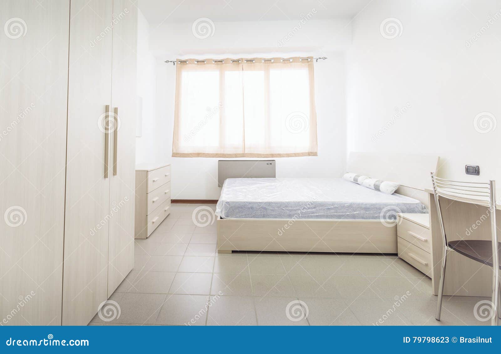 Simple Student-style Dorm Bedroom with Lots of Light Stock Image ...