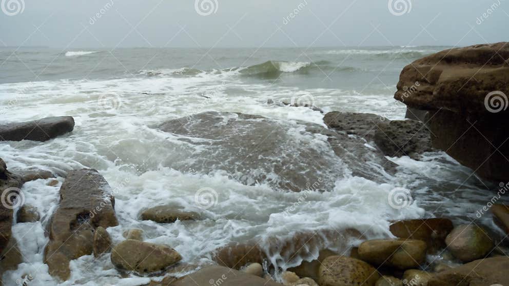 A Simple View of the Waves Breaking on the Smooth Rocks Stock Photo ...