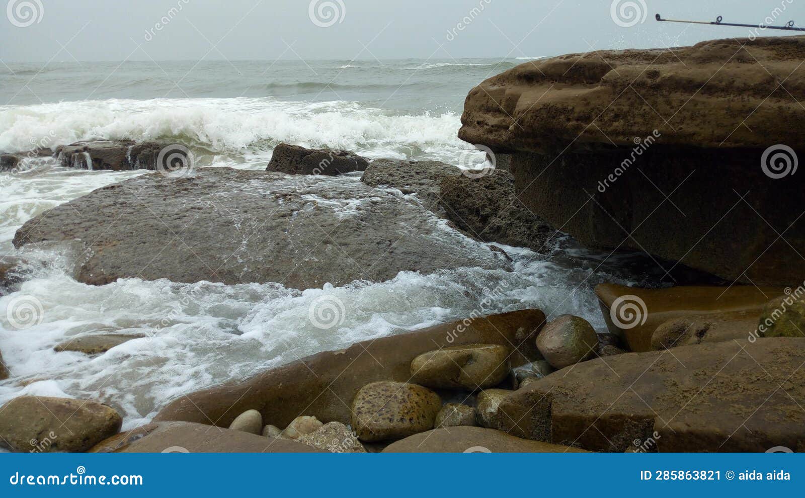 A Simple View of the Waves Breaking on the Smooth Rocks Stock Image ...