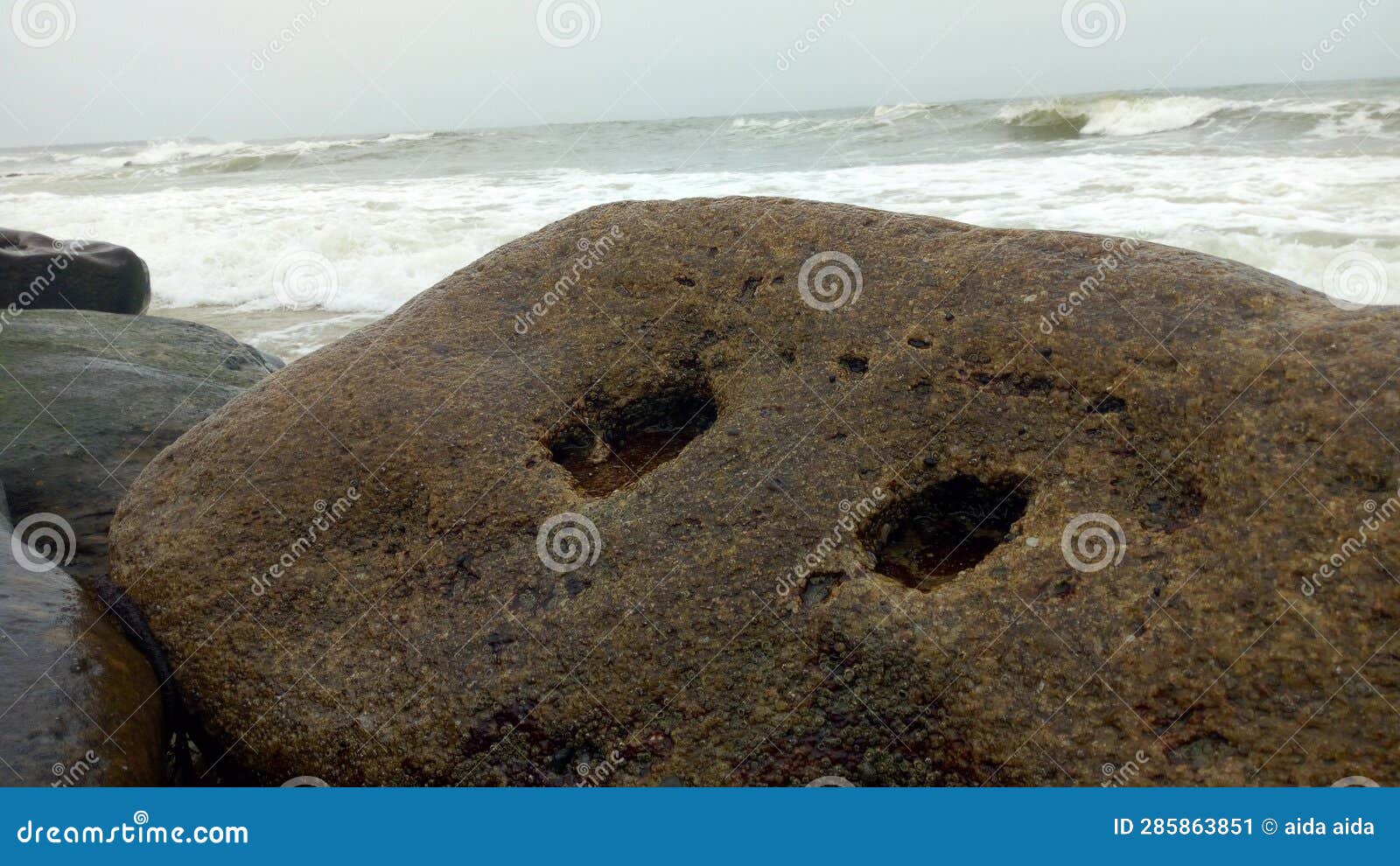 A Simple View of the Waves Breaking on the Smooth Rocks Stock Image ...