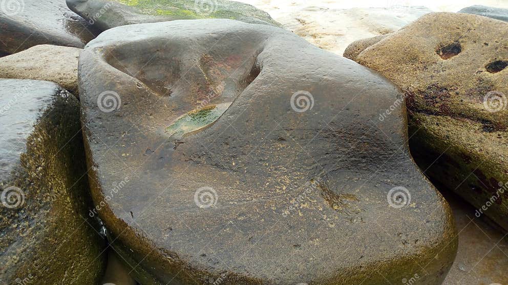 A Simple View of the Waves Breaking on the Smooth Rocks Stock Photo ...