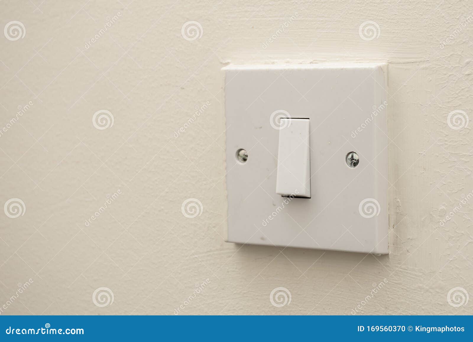 A Simple White Electrical Light Switch on a White Wall. Industrial ...