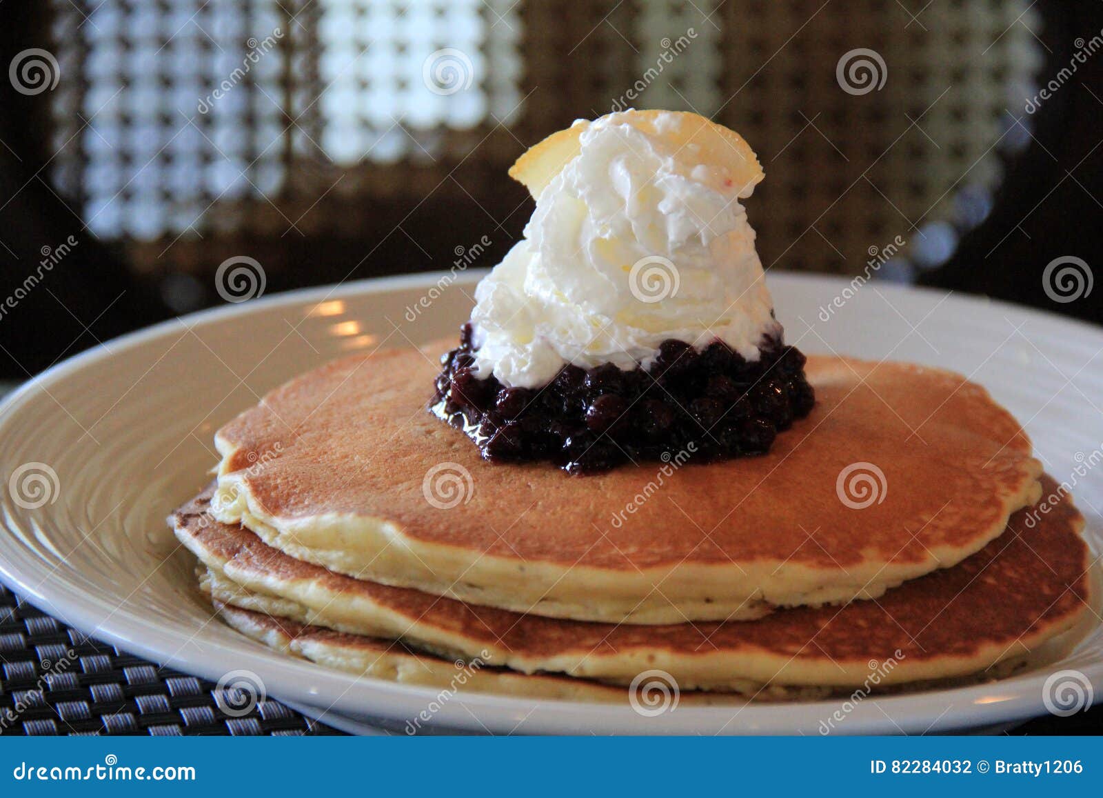 Simple White Plate with Stack of Pancakes Covered in Blueberries and ...