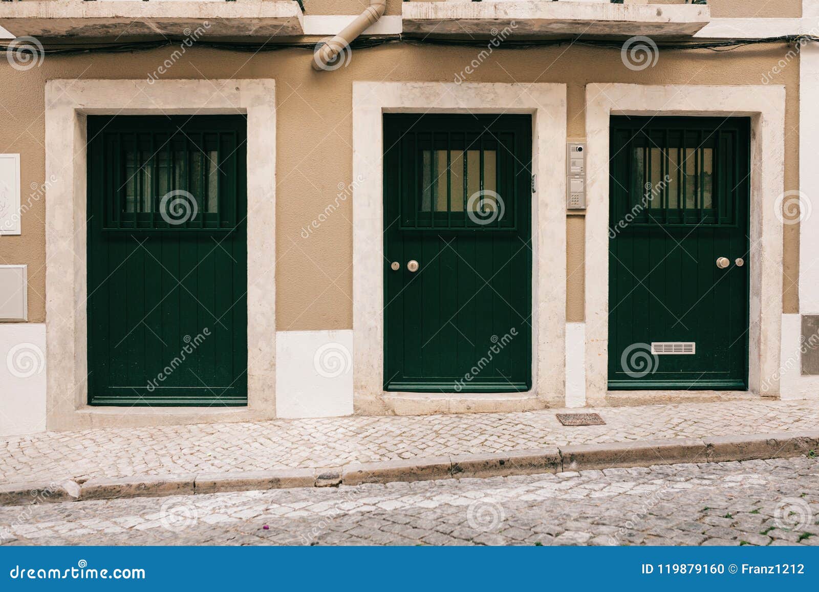 Simple Wooden Entrance Doors are Arranged in a Row Stock Photo - Image ...