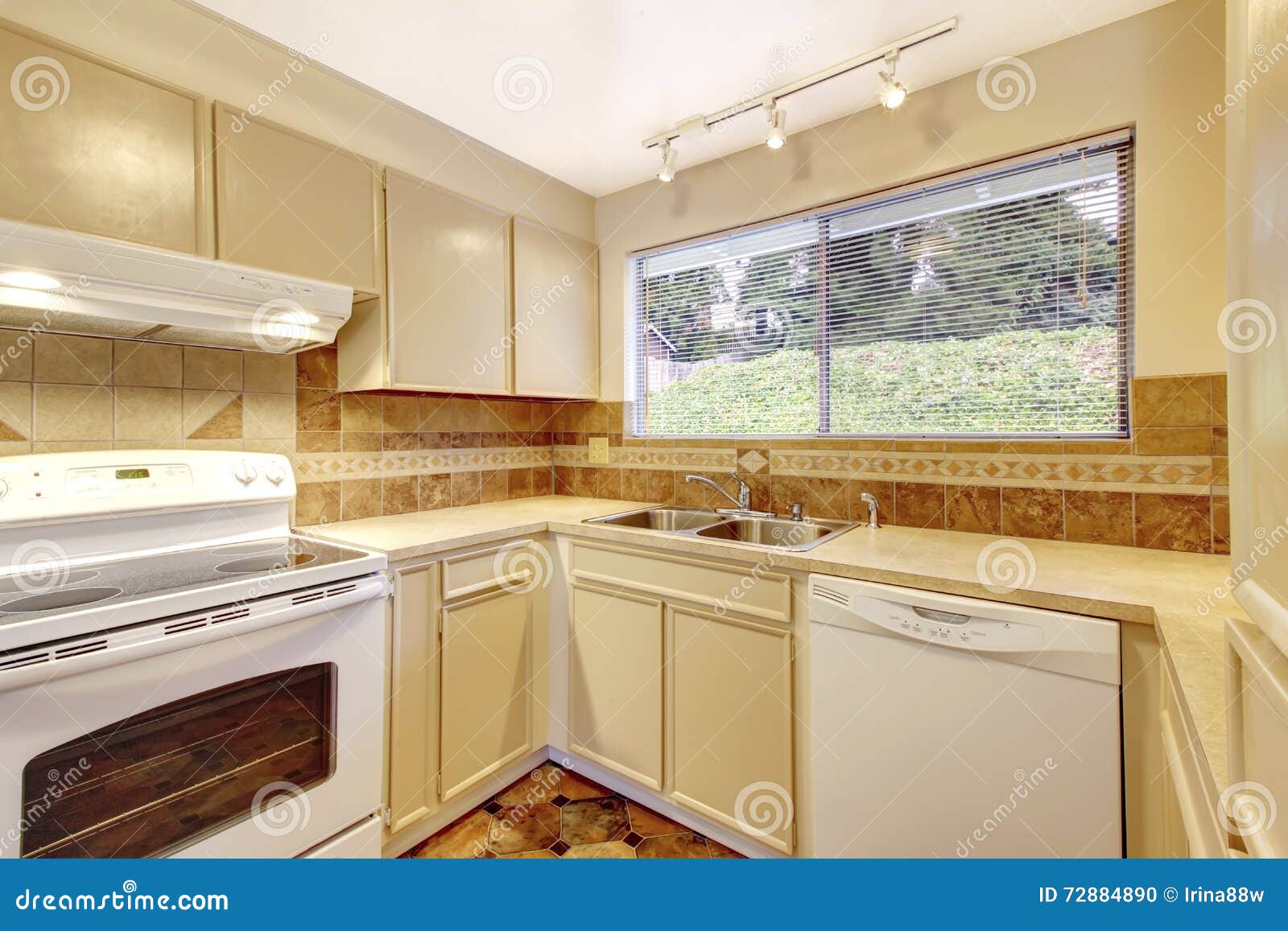 Simplistic Kitchen Room Interior with Beige Cabinets and Tile. Stock ...