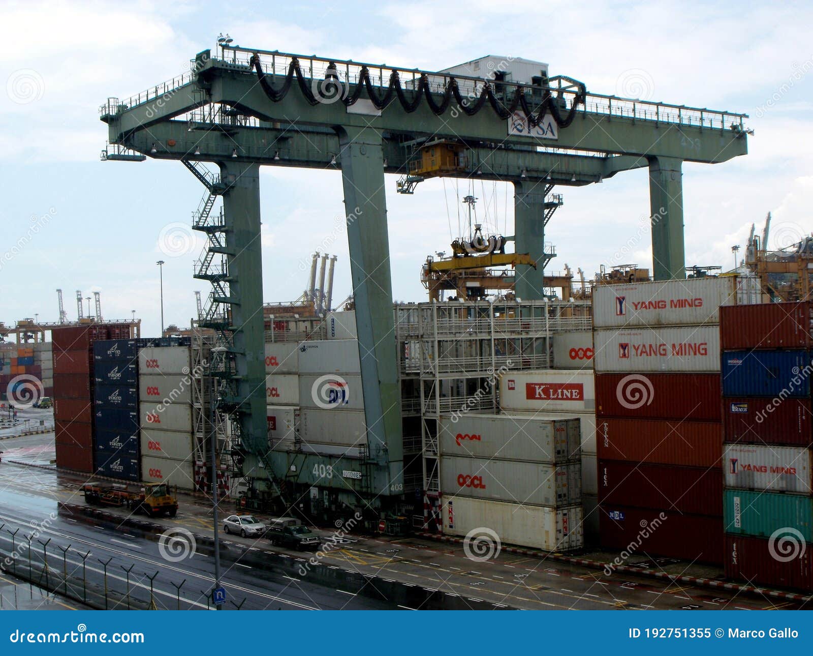 Containers Stacked Next To a Container Loading and Unloading Crane at ...