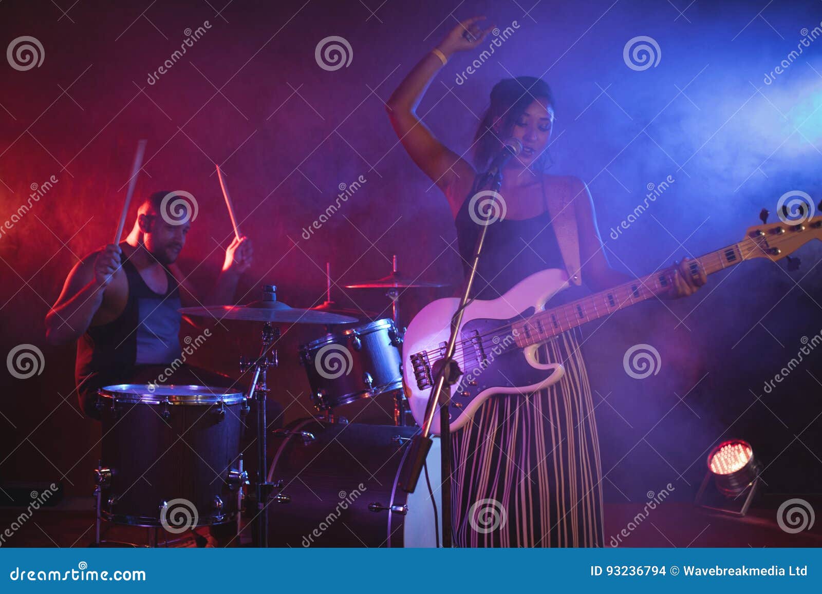 Singer and Drummer Performing in Nightclub Stock Photo - Image of ...