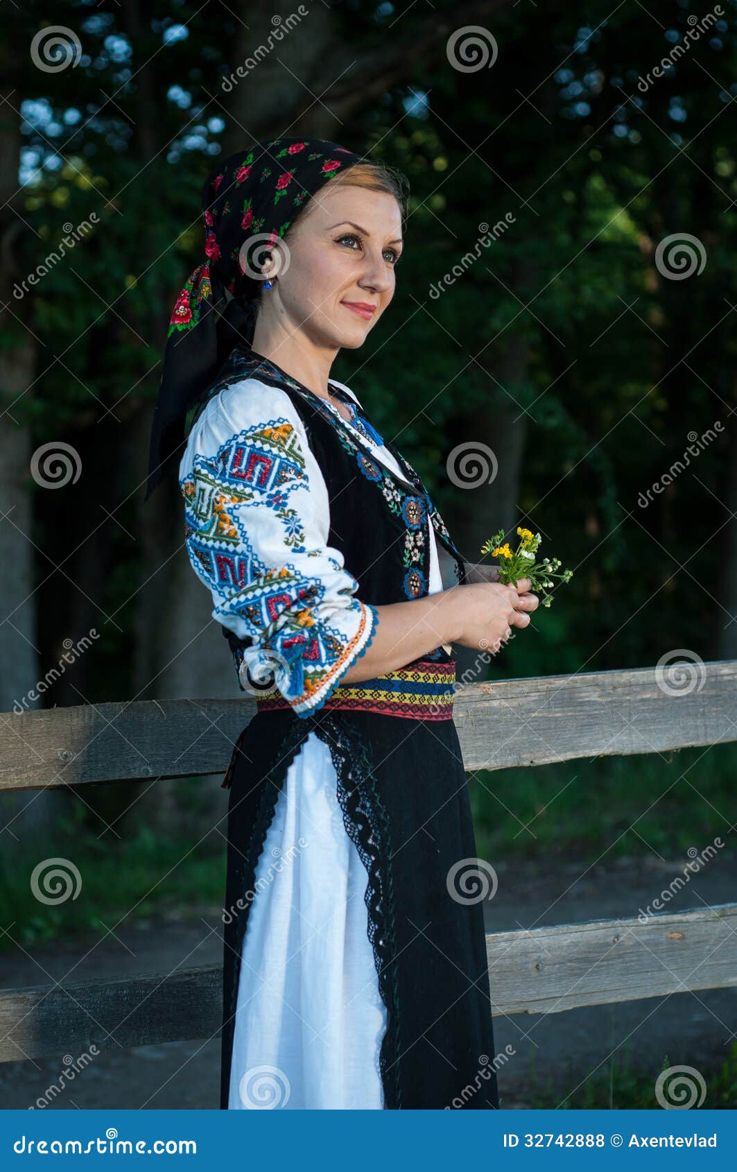Singer with Flowers in Her Hands Posing at Countryside Stock Photo ...