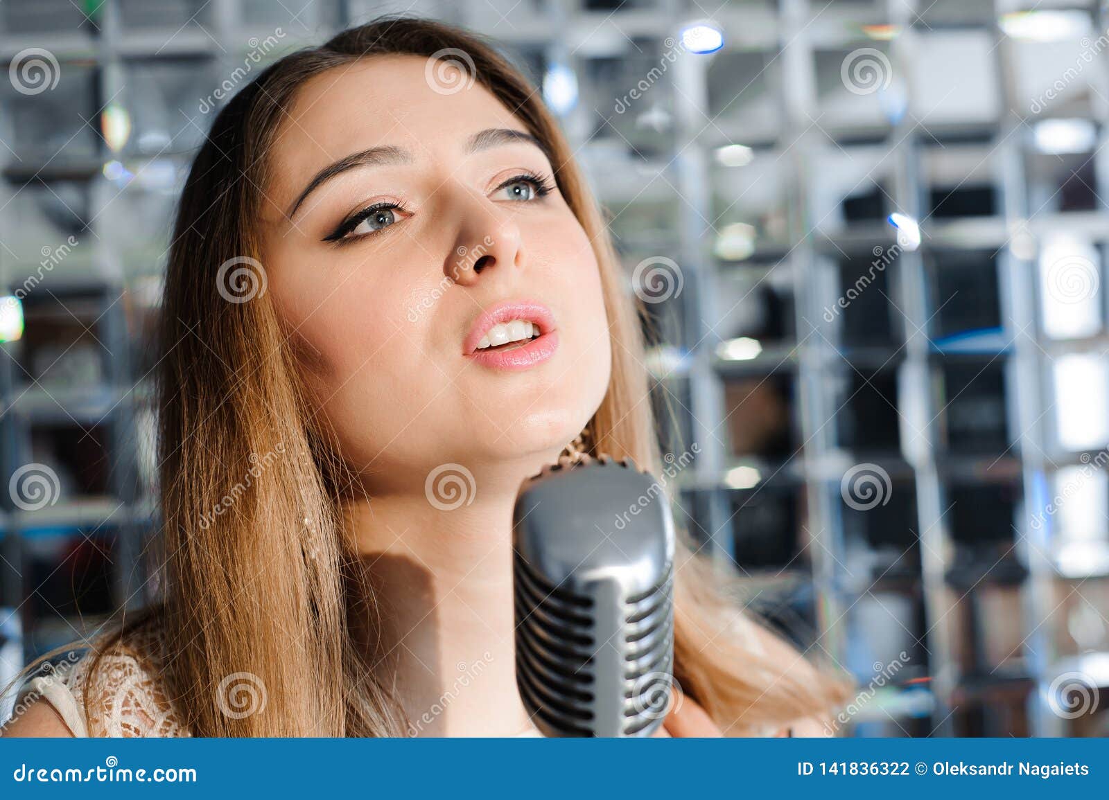 Singer in Front of a Microphone. Beautiful Woman Singing on the Stage ...