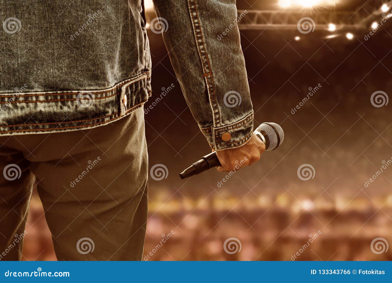 Singer Holding Microphone on the Stage Stock Photo - Image of event ...