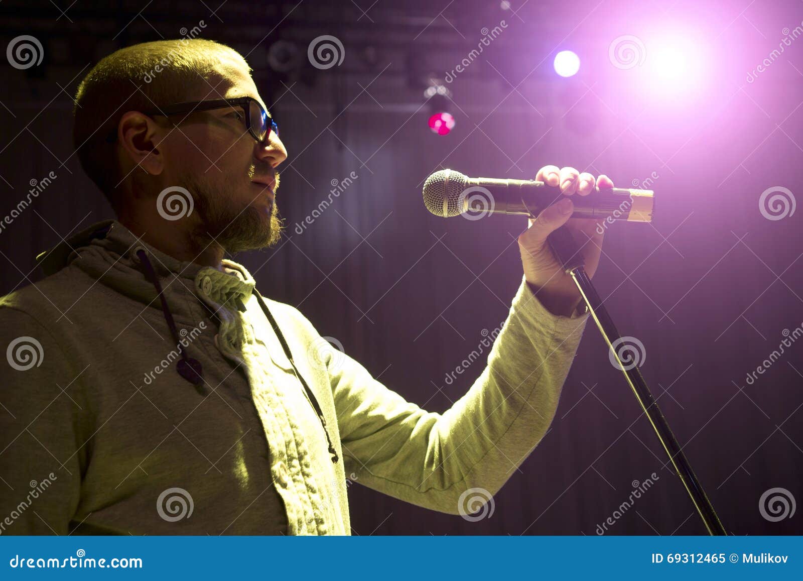 Singer Holding a Microphone and Singing Stock Image - Image of rage ...