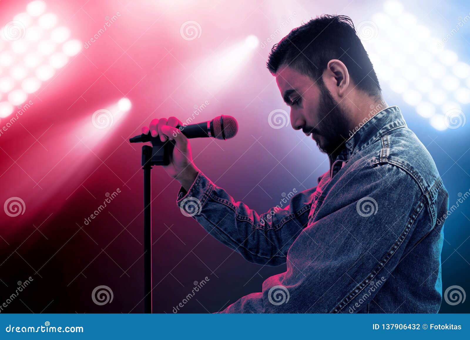 Singer Holding Microphone on the Stage Stock Photo - Image of media ...