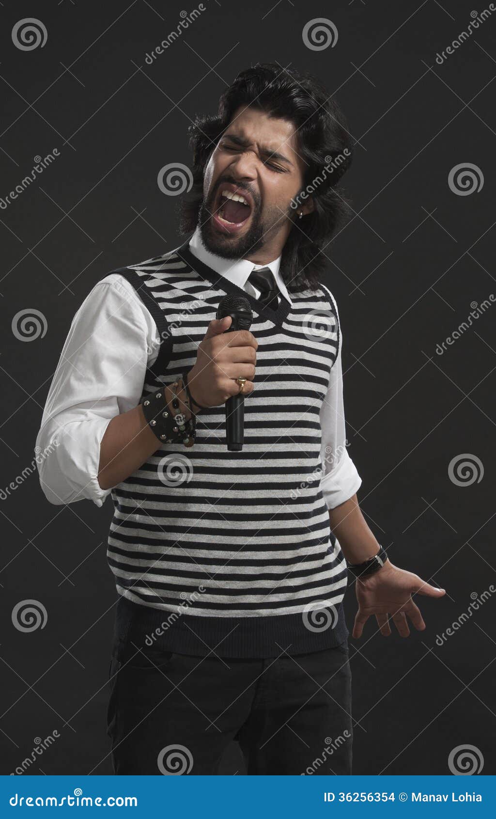 Singer Holding a Mike and Singing Stock Photo - Image of mike ...