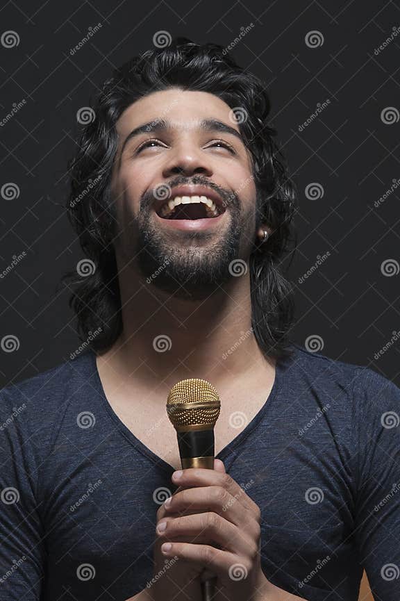 Singer Holding a Mike and Singing Stock Image - Image of 2024, singer ...