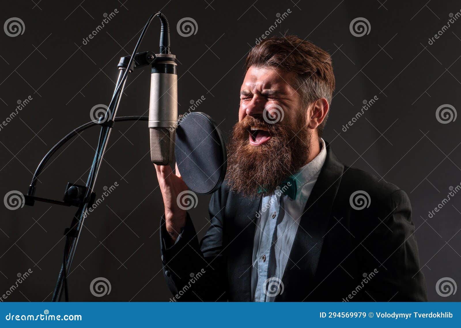 Singer Man Singing with a Microphone in Recording Studio. Stock Image ...