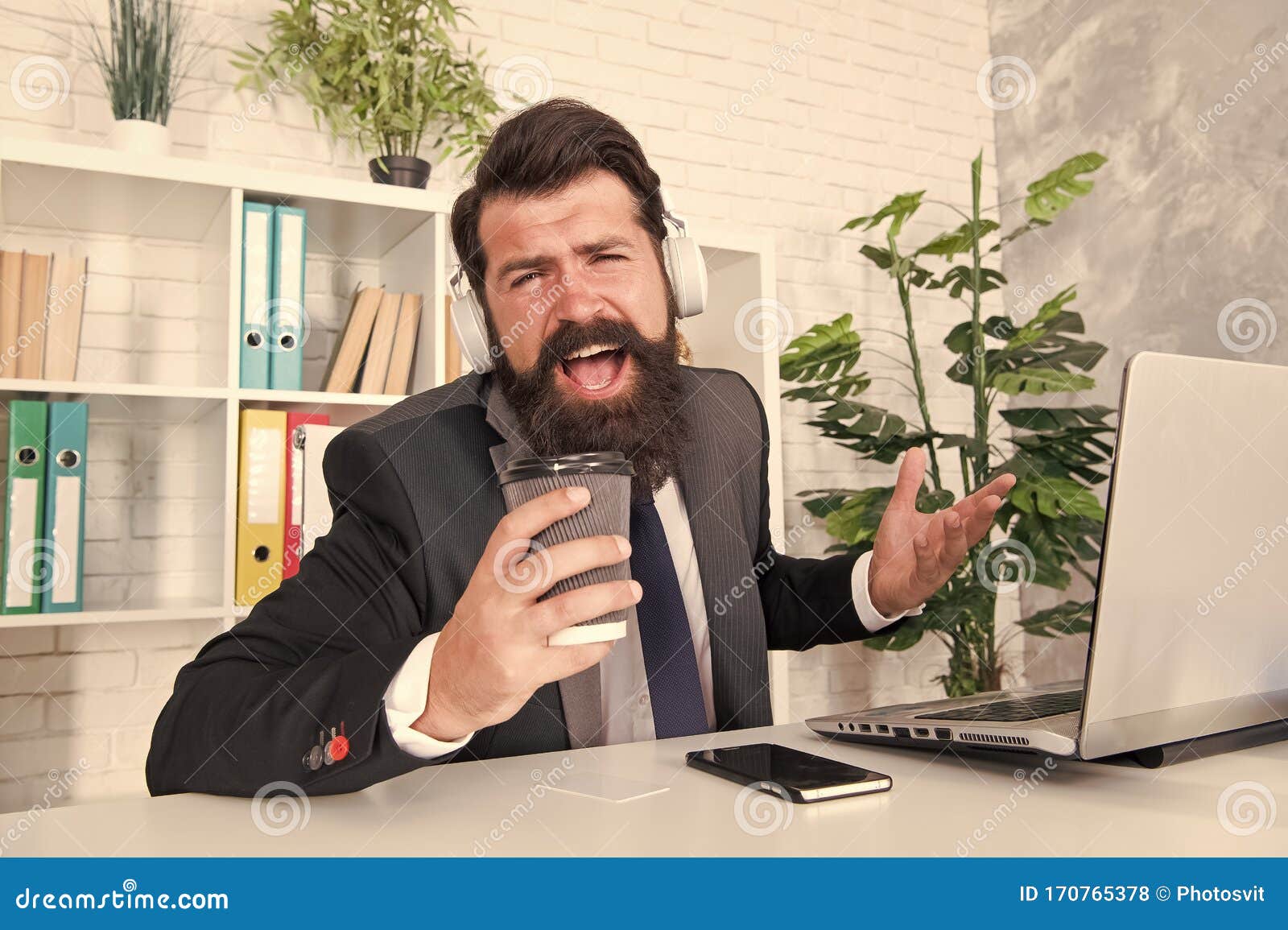 Singer or Manager. Office Manager Sing Karaoke Using Coffee Cup ...