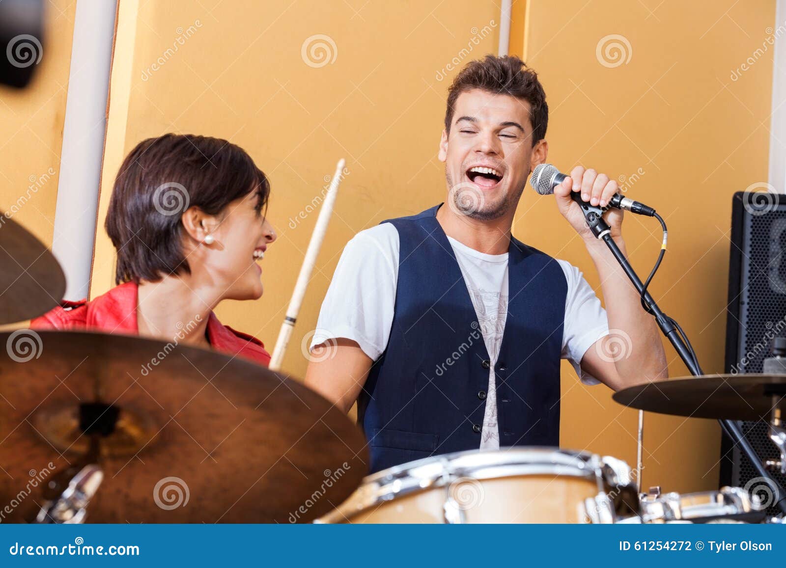 Singer Performing while Looking at Drummer Stock Photo - Image of ...
