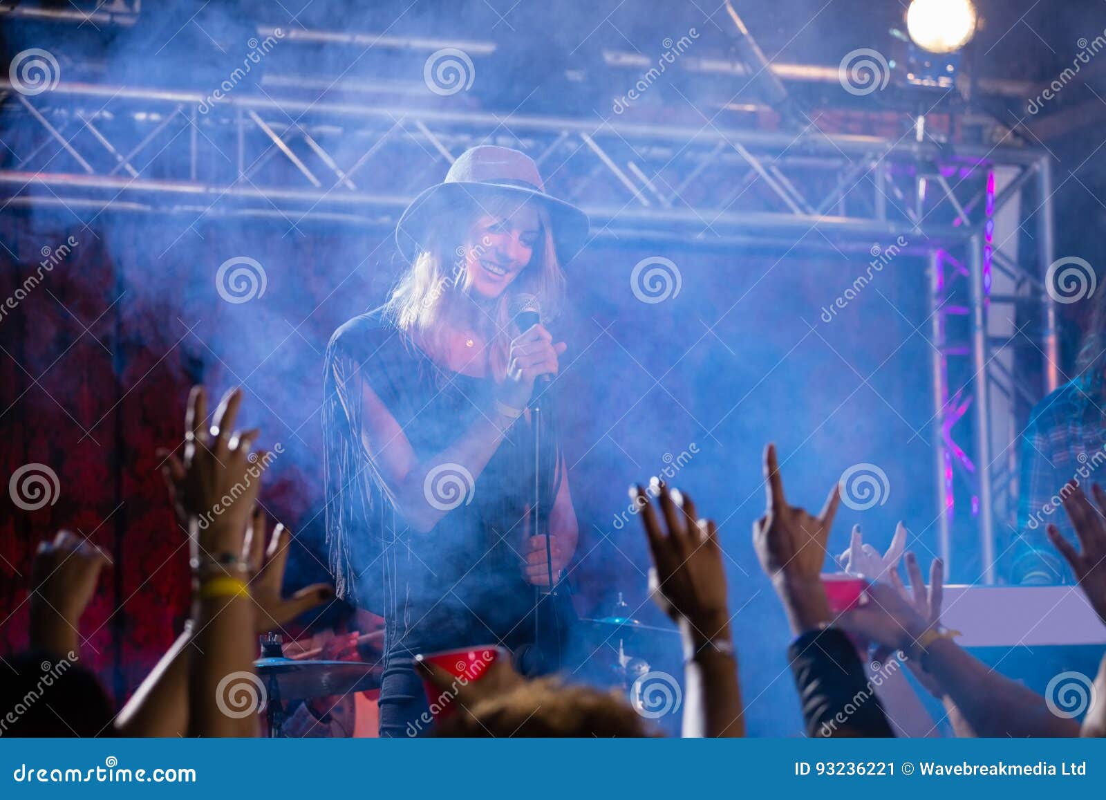 Singer performing on stage stock image. Image of female - 93236221