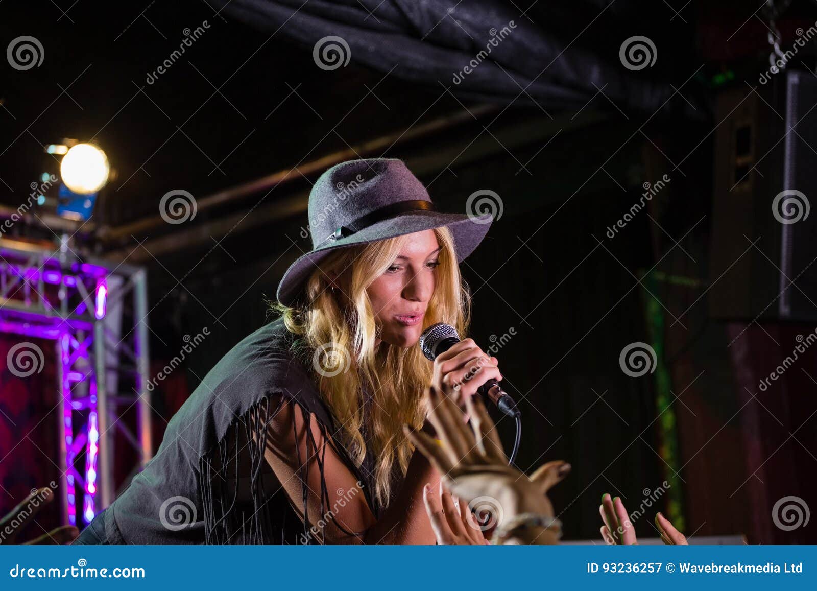 Singer performing on stage stock image. Image of casual - 93236257