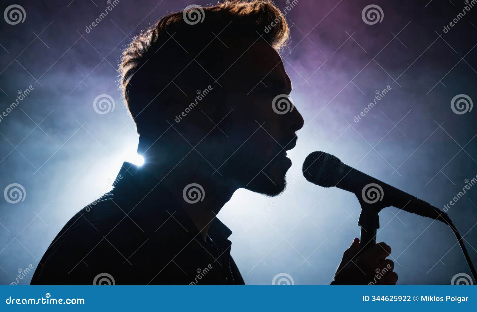 A Singer Performs on Stage, Illuminated by a Bright Spotlight Stock ...