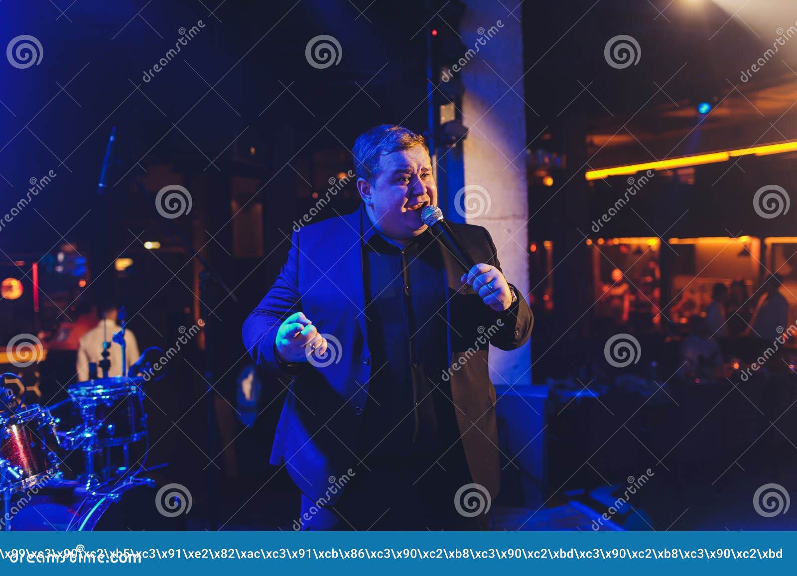 Singer Performs on the Stage Illuminated by Lights. Stock Image - Image ...