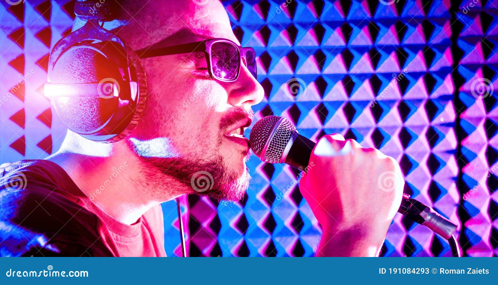 The Singer Sings with a Microphone in the Recording Studio. Stock Image ...