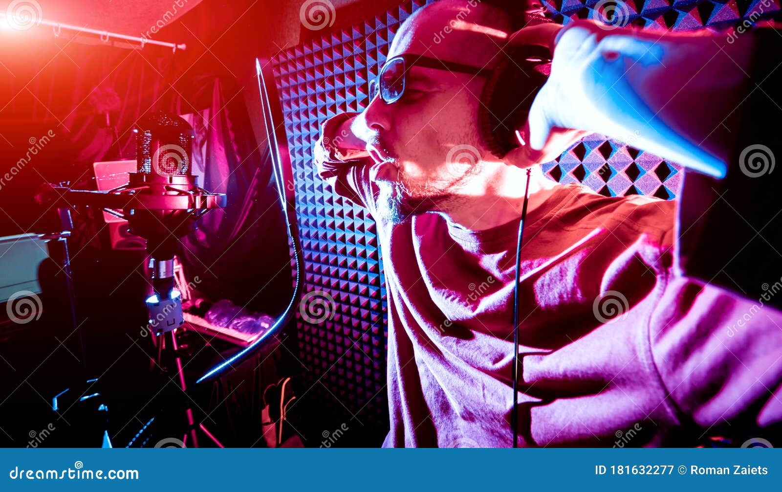 The Singer Sings with a Microphone in the Recording Studio. Stock Image ...