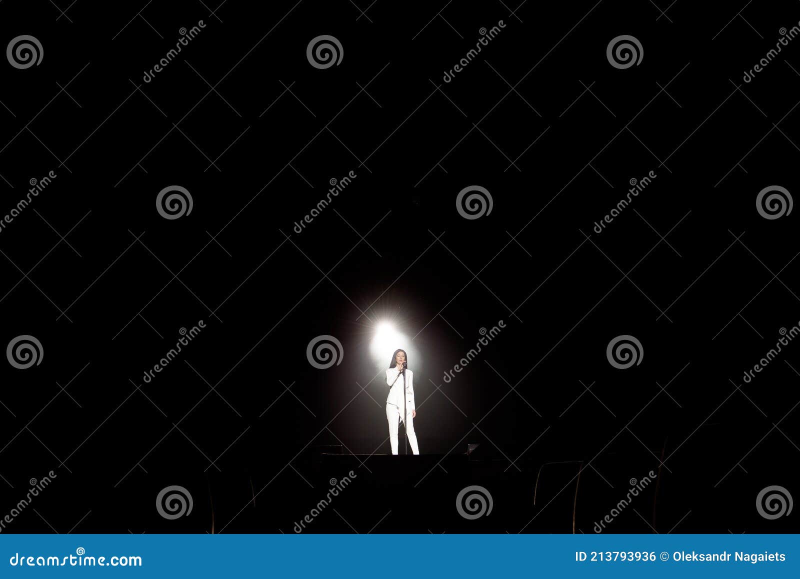 Singer on Stage in a Beam of White Light. Stock Photo - Image of light ...