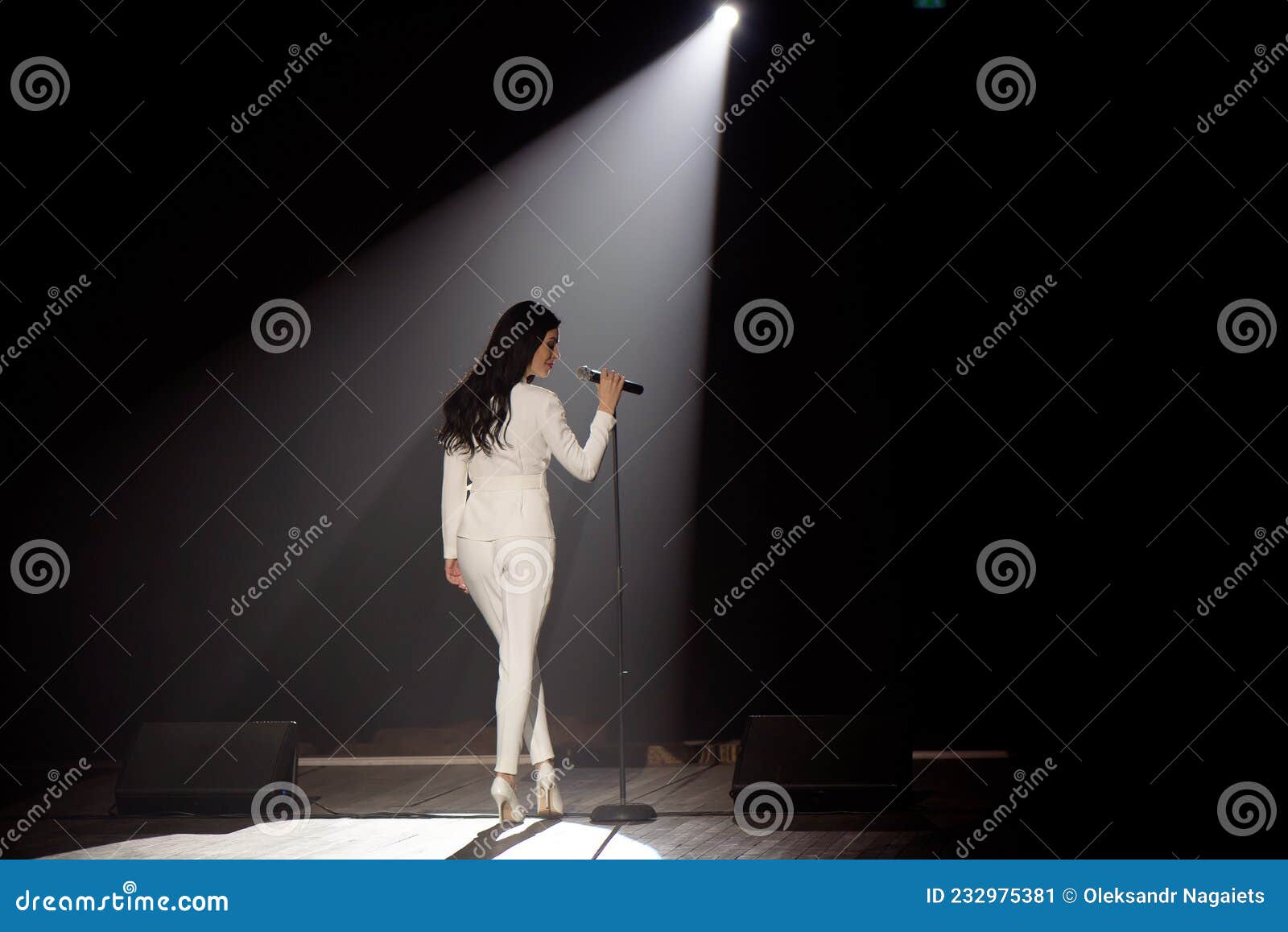 Singer on Stage in a Beam of White Light. Stock Image - Image of beam ...