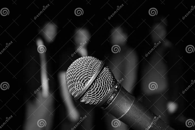Singers behind a mic stock photo. Image of people, performers - 9920674