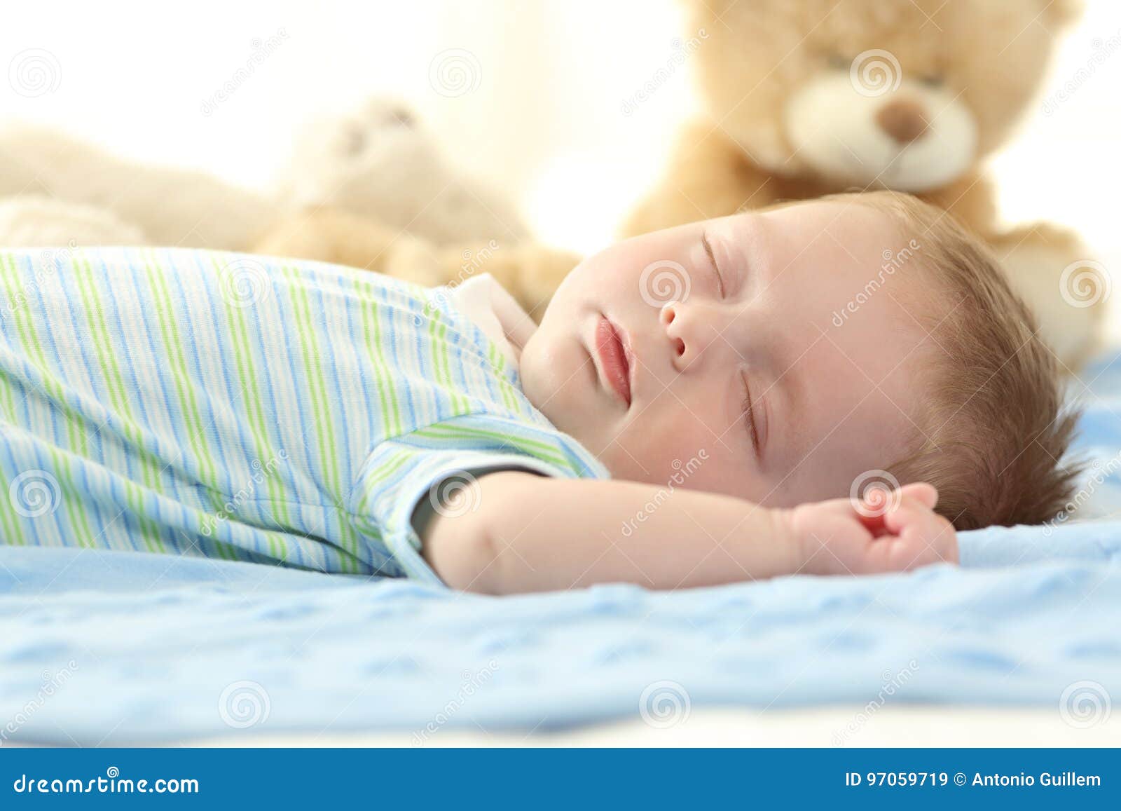 Single Baby Sleeping on a Bed Stock Image - Image of blanket, blue ...