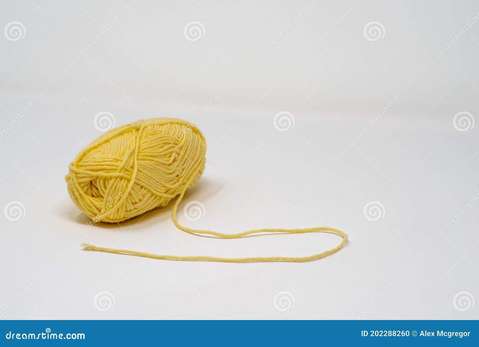 Single ball of yellow wool stock photo. Image of string - 202288260