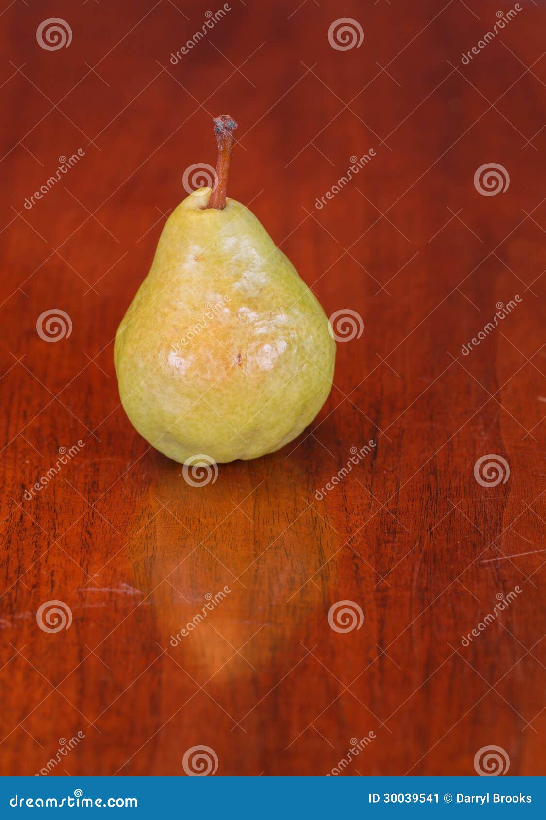 Single Pear on Wood Table stock image. Image of vegetarian - 30039541