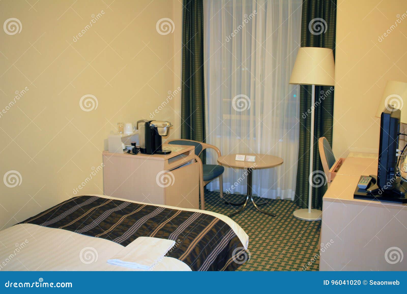 Single bed in hotel room stock photo. Image of paint - 96041020