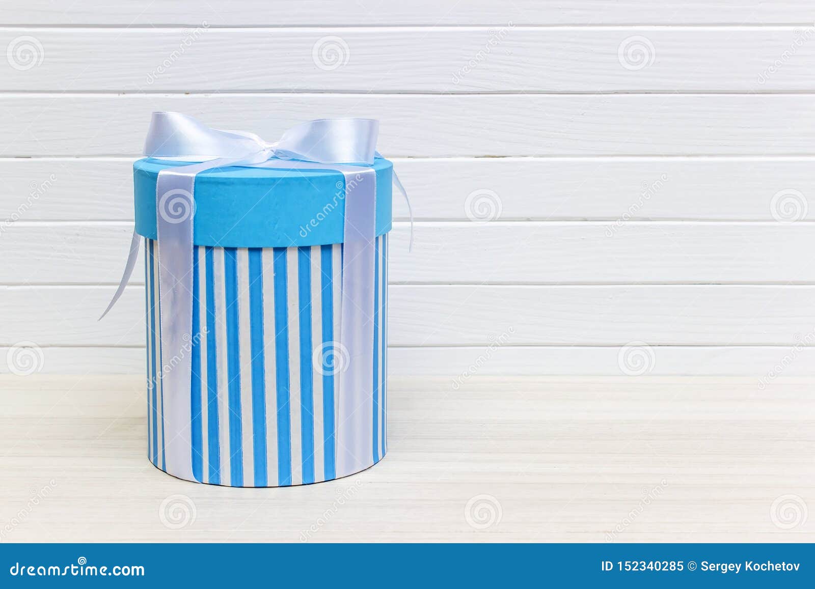 Single Blue Gift Box on White Wood Table Stock Image - Image of blue ...