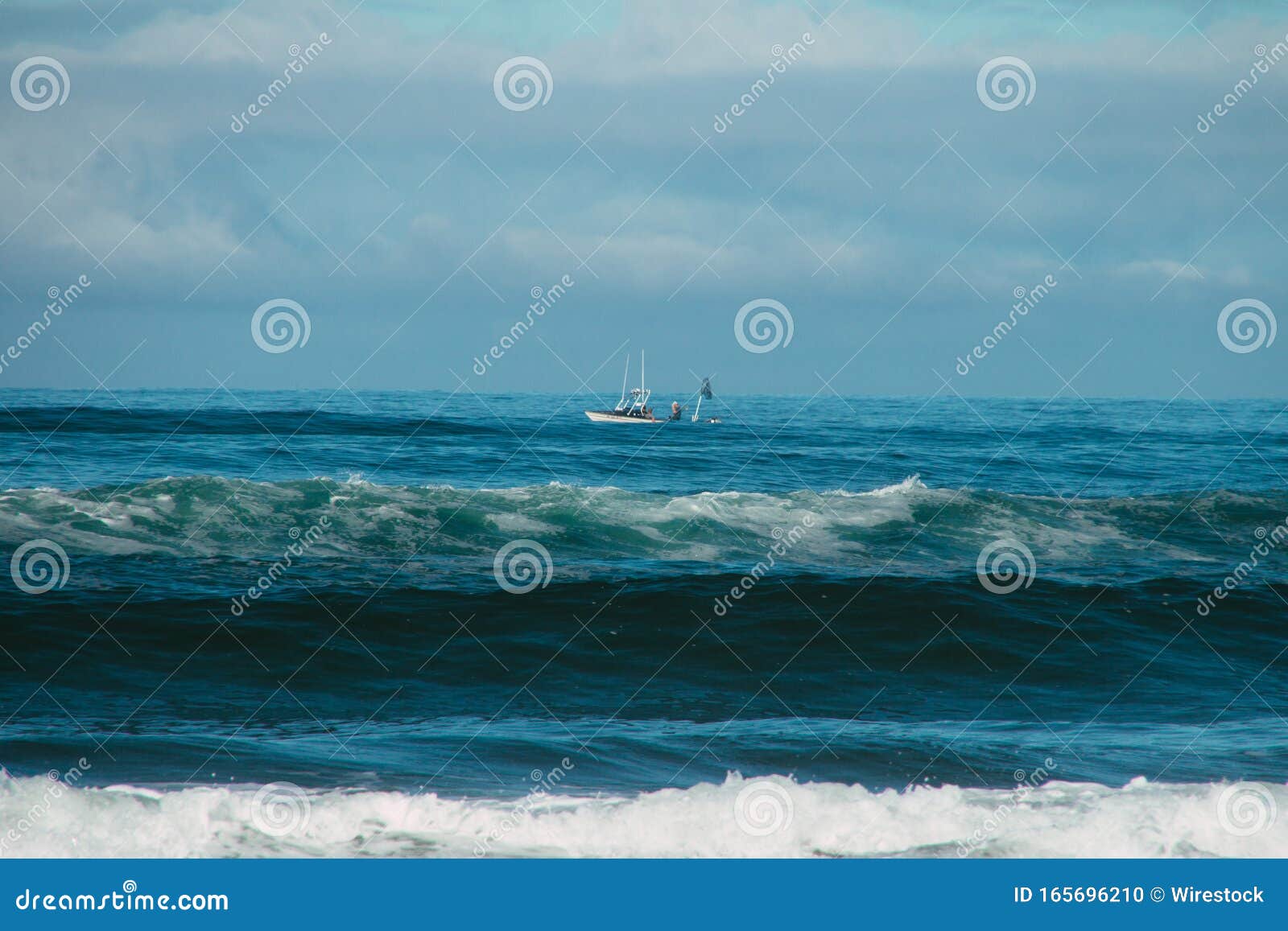 Single Boat Sailing in the Middle of the Wavy Sea during Daytime Stock ...