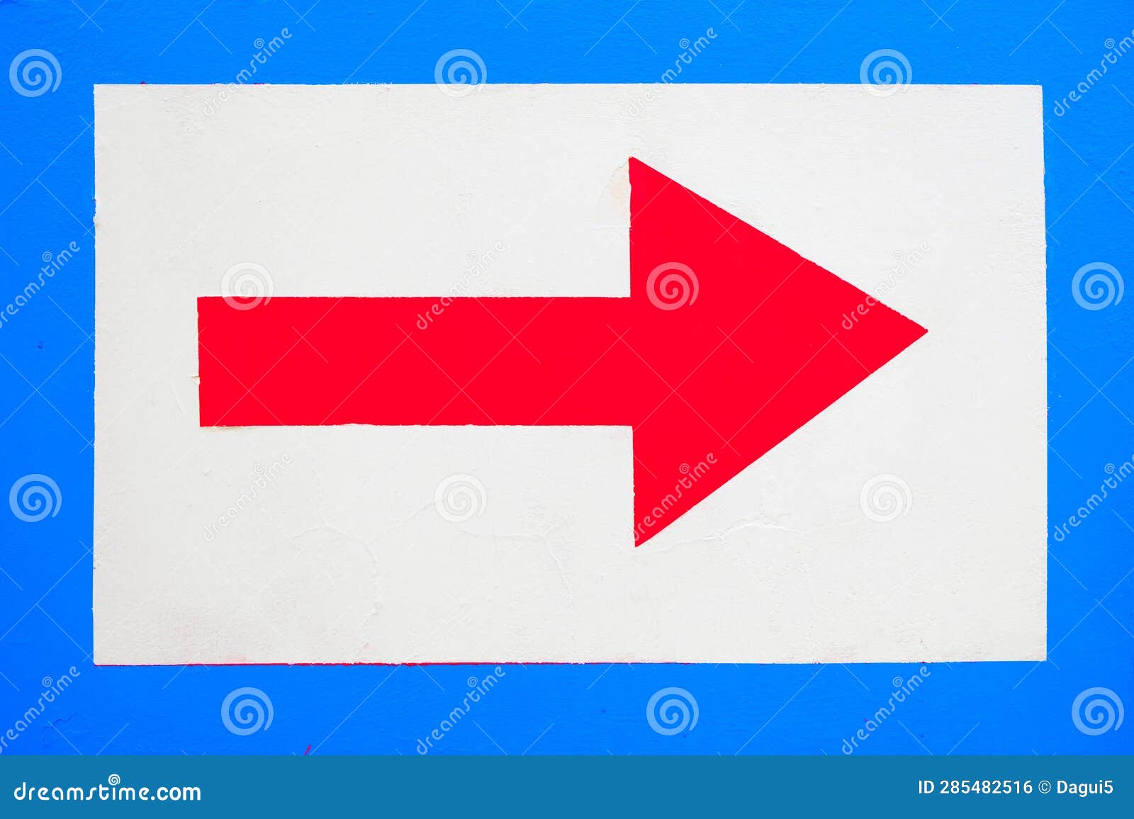 Red Arrow on White and Blue Background Stock Photo - Image of sign ...