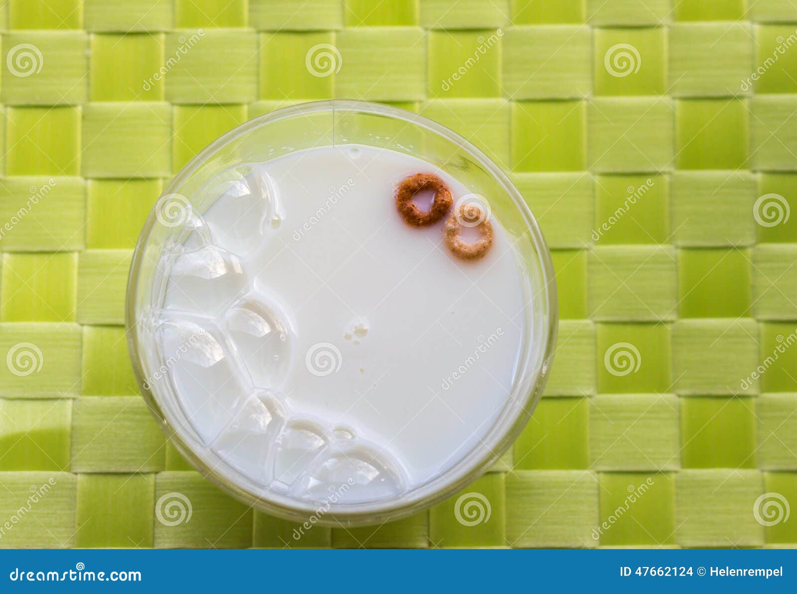 Single Bowl of Milk with Bubbles and Two Cheerios Floating Around ...